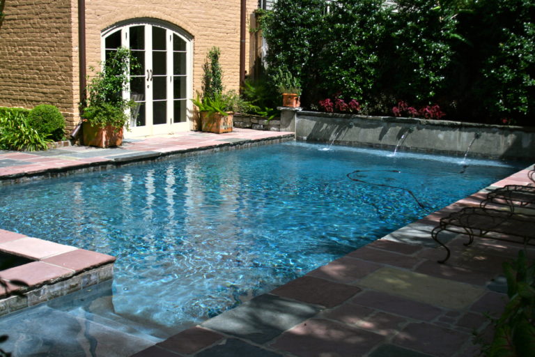 Uptown New Orleans swimming pool and hot tub with stucco wall and ...