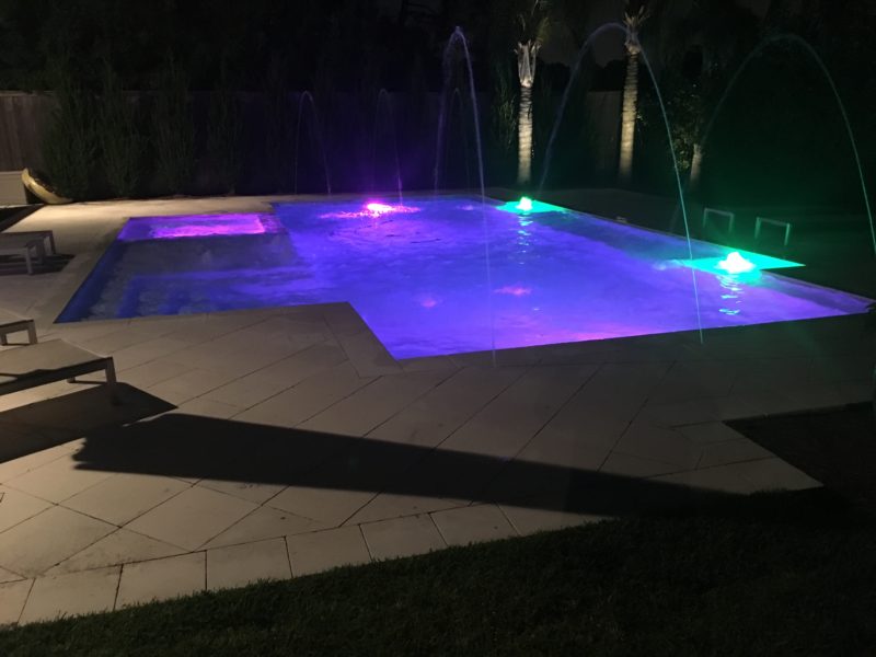 Swimming pool night with colored LED bubblers and deck jets - Crystal ...