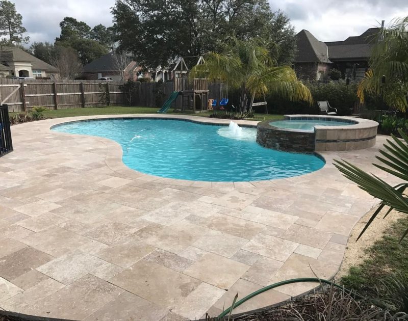 Mandeville white plaster pool with travetine deck and stone spa ...