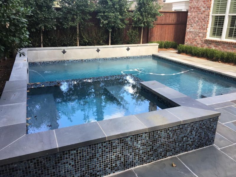 Mosaic tile and flagstone pool deck - Crystal Pools and Spas