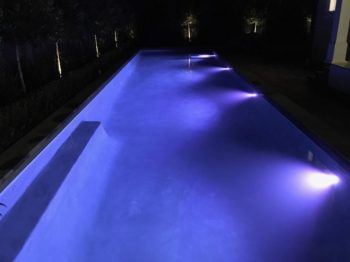 Purple color pool lighting - Crystal Pools and Spas