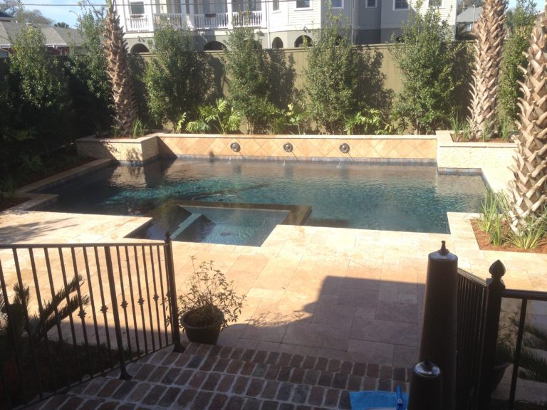 Raised stone wall and travertine deck on hot tub and pool - Crystal ...