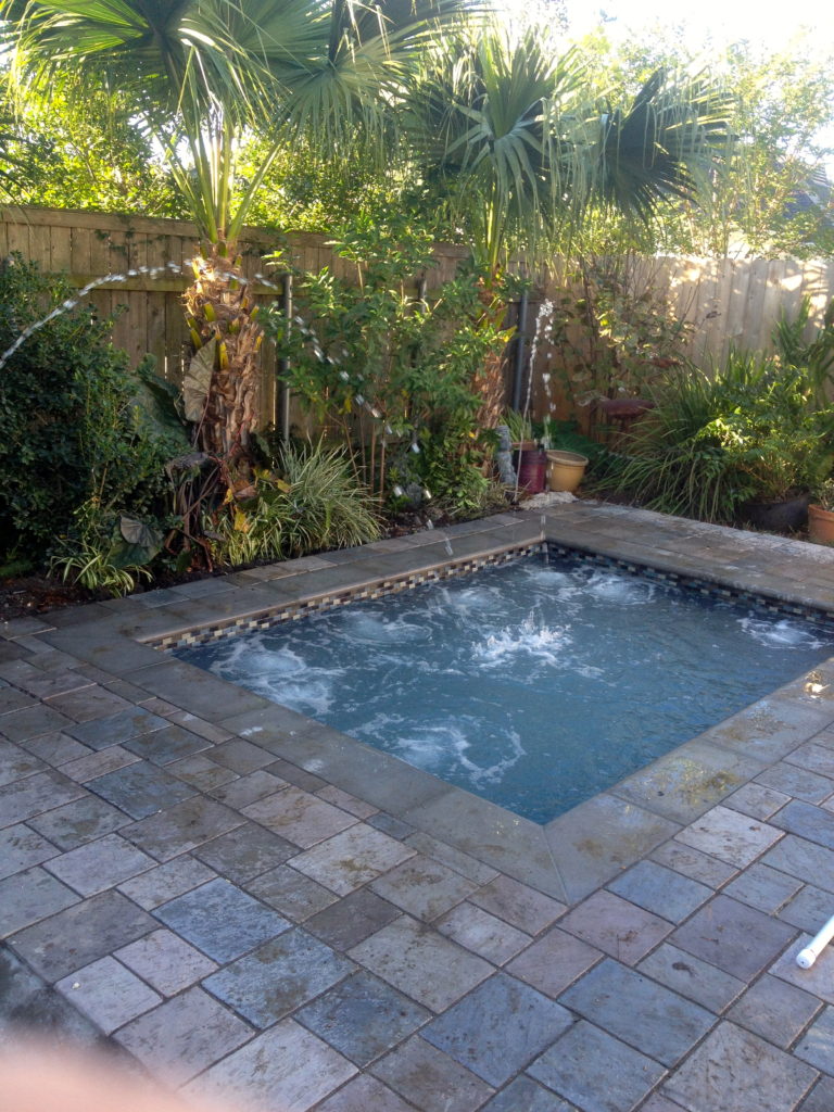 Spa with deck jets and paver deck - Crystal Pools and Spas
