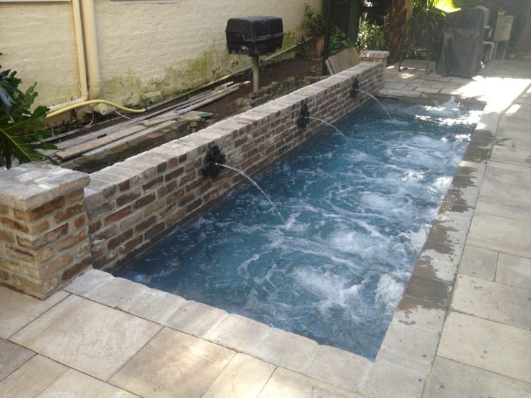 Therapy pool with brick wall - Crystal Pools and Spas