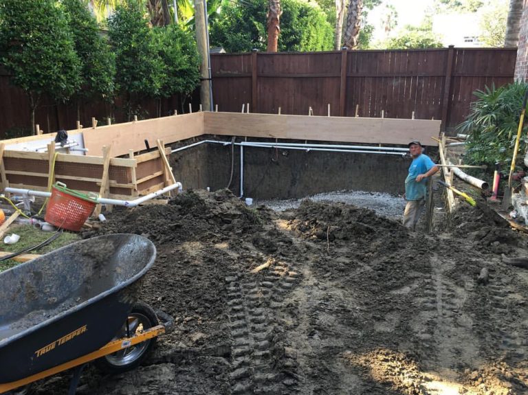 Tight yard pool being dug and formed - Crystal Pools and Spas
