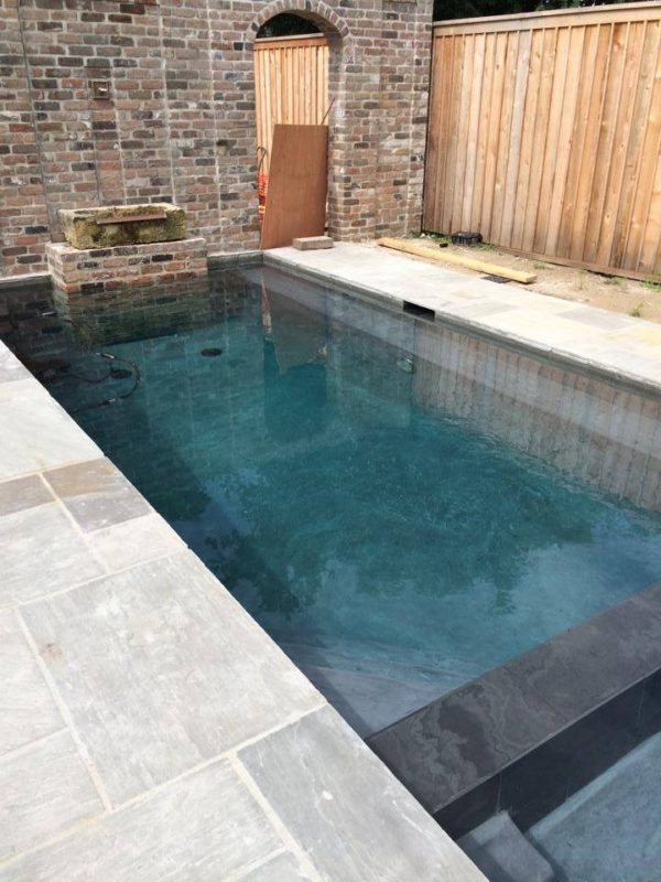 gray swimming pool and spa - Crystal Pools and Spas