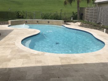 River Ridge Lagoon swimming pool and stone wall - Crystal Pools and Spas